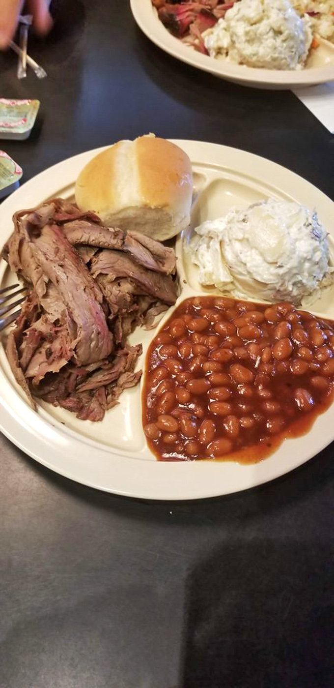 Brisket that doesn't just fall apart&mdash;it surrenders with dignity, accompanied by beans and potato salad that know their supporting roles.