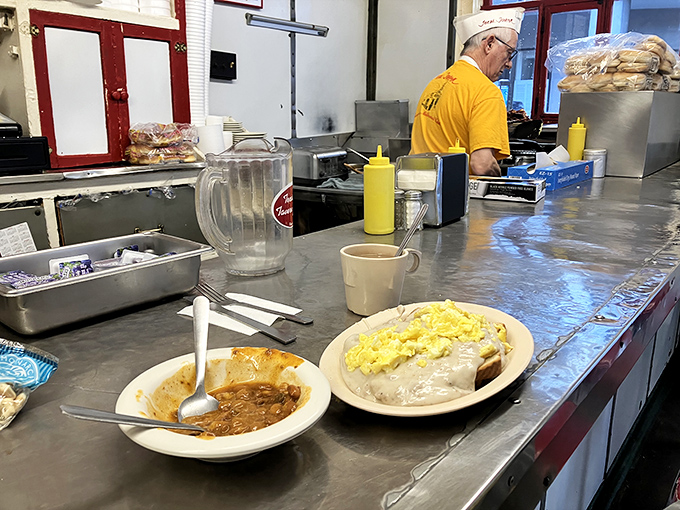 Breakfast nirvana exists, and it looks suspiciously like this plate of sausage gravy smothering toast while eggs stand by, ready for their close-up.