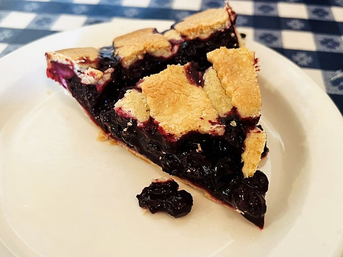 This slice of blueberry pie isn't just dessert&mdash;it's a purple-hued masterpiece with a perfectly flaky crust that shatters like delicious glass with each forkful.