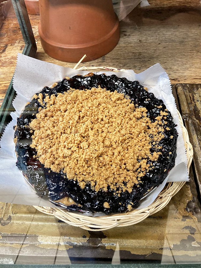 This blueberry crumble pie isn't just dessert, it's edible poetry. The contrast between that golden topping and deep purple filling is nature's perfect color scheme.