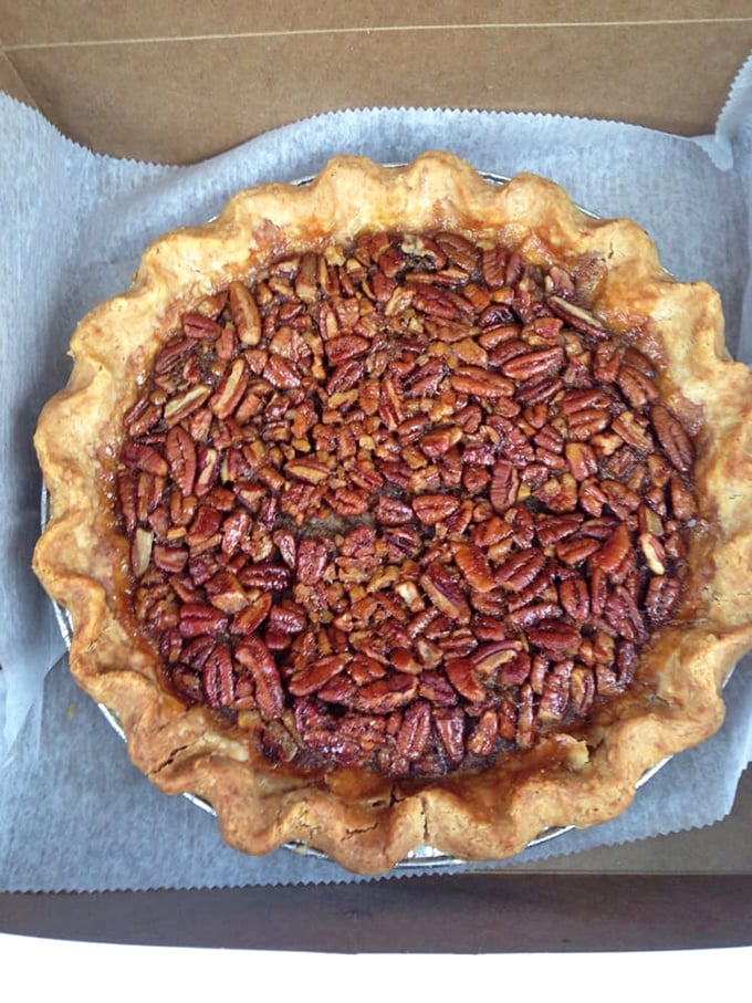 The Bourbon Pecan pie isn't just a dessert, it's an event. Those perfectly arranged pecans sitting atop that glistening filling are basically throwing a party and your taste buds are invited.