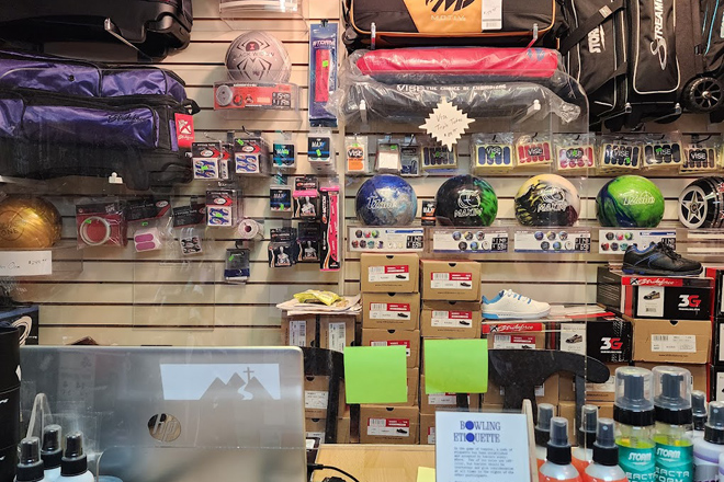The pro shop wall&mdash;where bowling dreams are born and casual players suddenly find themselves contemplating personalized balls and wrist supports.