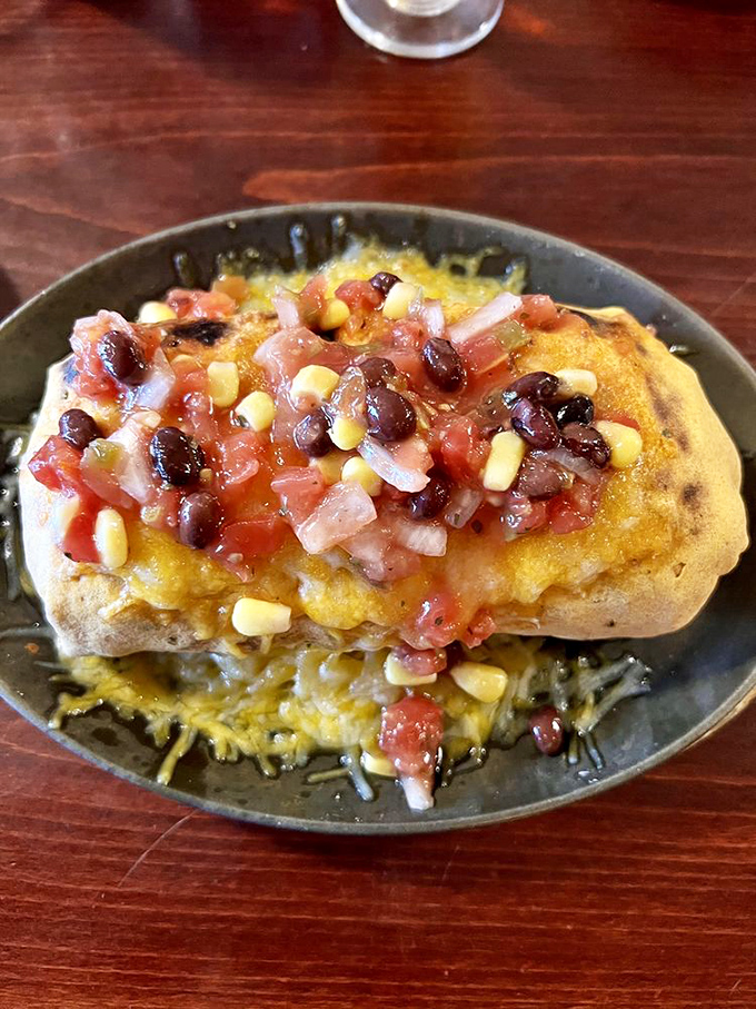 This isn't just any omelet&mdash;it's a masterclass in breakfast architecture where vibrant spinach and roasted peppers meet perfectly seasoned eggs in harmonious union.