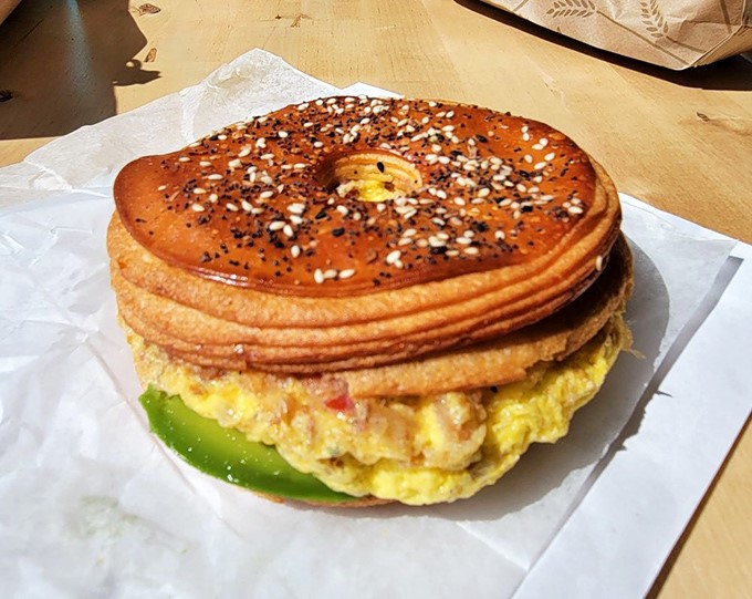 This breakfast sandwich isn't just food &ndash; it's architecture. The layered Cro'Gel creates the perfect ratio of crispy exterior to fluffy interior with eggs peeking through.