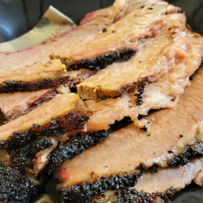 Brisket so perfectly rendered it makes you wonder if there's some sort of meat whisperer working behind the scenes. That bark! That smoke ring!