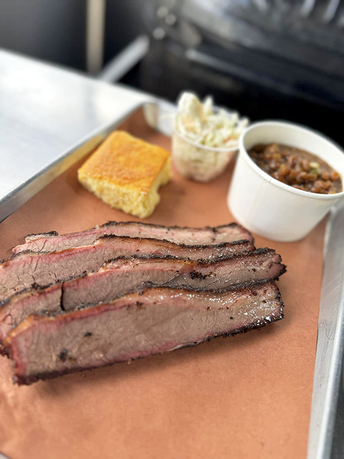 Brisket so perfectly smoked it makes Texans nervous. That pink smoke ring is the barbecue equivalent of a Michelin star.