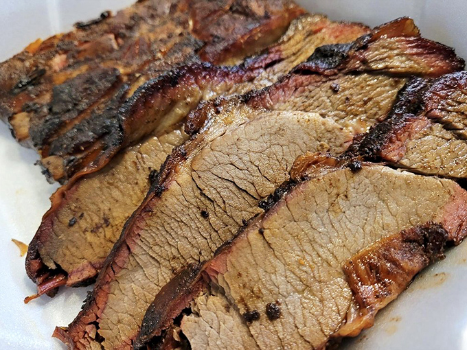 Behold the brisket in all its glory&mdash;that pink smoke ring is like nature's way of saying "you're welcome" to your taste buds.