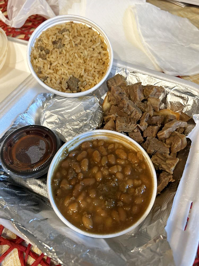 Brisket so tender it practically surrenders to your fork, accompanied by beans that have clearly been taking notes during the smoking process.