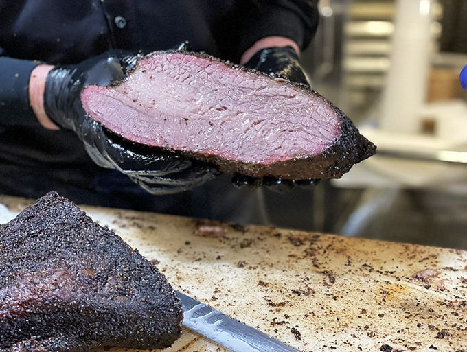That smoke ring isn't just for show&mdash;it's the pink badge of honor that tells you this brisket has been treated with proper time and respect.