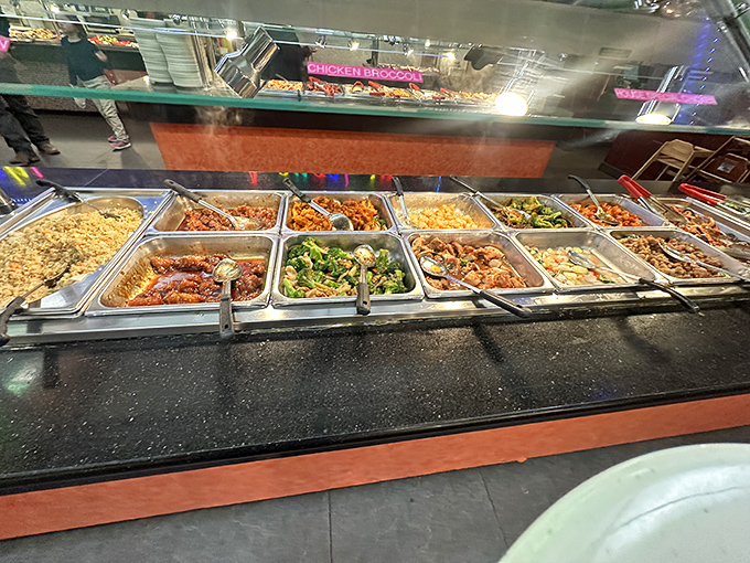 A treasure trove of Asian delights awaits, with chicken, broccoli, and noodles standing at attention like delicious soldiers.