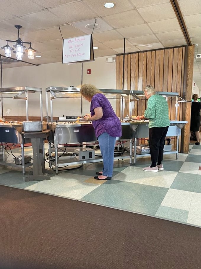 The buffet line&mdash;where diet plans go to die and happiness begins. Those steam trays contain more comfort than a therapy session.