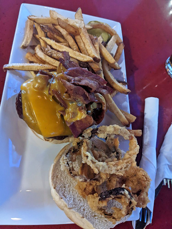 This isn't just a burger&mdash;it's a masterclass in simplicity. Golden fries, crispy onion rings, and a patty that makes fast food chains weep with inadequacy.