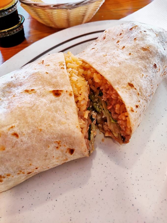 Behold the burrito in its natural splendor&mdash;perfectly grilled tortilla embracing a harmonious medley of rice, meat, and spices. Poetry in food form.