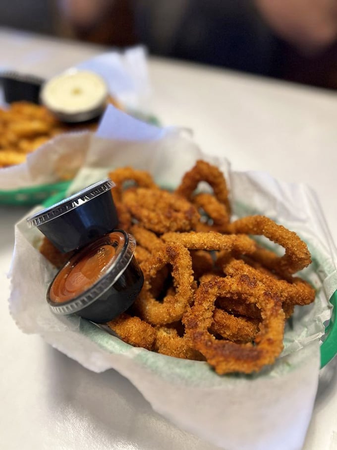 These golden calamari rings achieve the impossible: crispy exterior, tender interior, and zero rubber-band texture. Ocean perfection that even squid-skeptics will dive into.