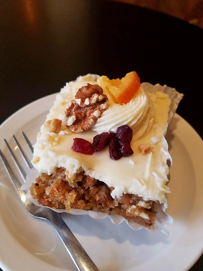 Behold: the mythical carrot cake that launches pilgrimages. Those walnuts and cranberries aren't just garnish&mdash;they're the crown jewels of Asheville's dessert kingdom.