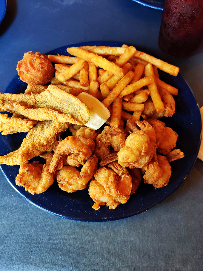 Golden treasures from the Gulf! This platter of perfectly fried catfish, shrimp and fries is essentially Mississippi on a plate.