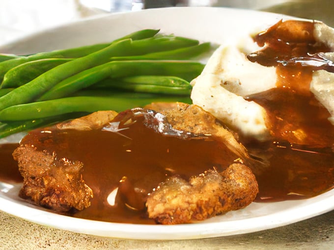 Behold the star of the show&mdash;chicken fried steak bathed in gravy so good you'll want to write home about it, if you weren't too busy eating.