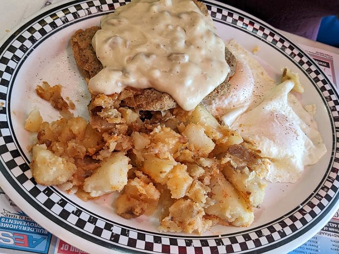 Behold the star attraction: chicken fried steak smothered in peppery gravy with a supporting cast of crispy hash browns. Comfort food that hugs your soul.
