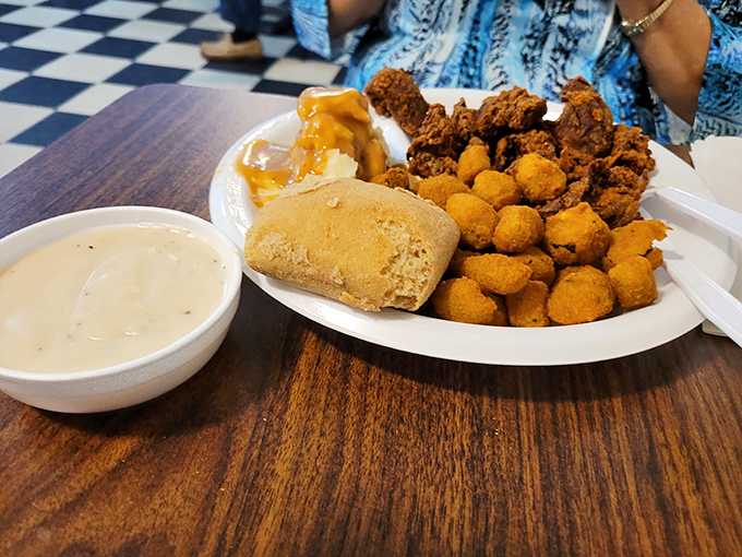 Southern comfort on a plate: golden-fried chicken livers, crispy tater tots, and okra that would make your grandmother nod in approval.