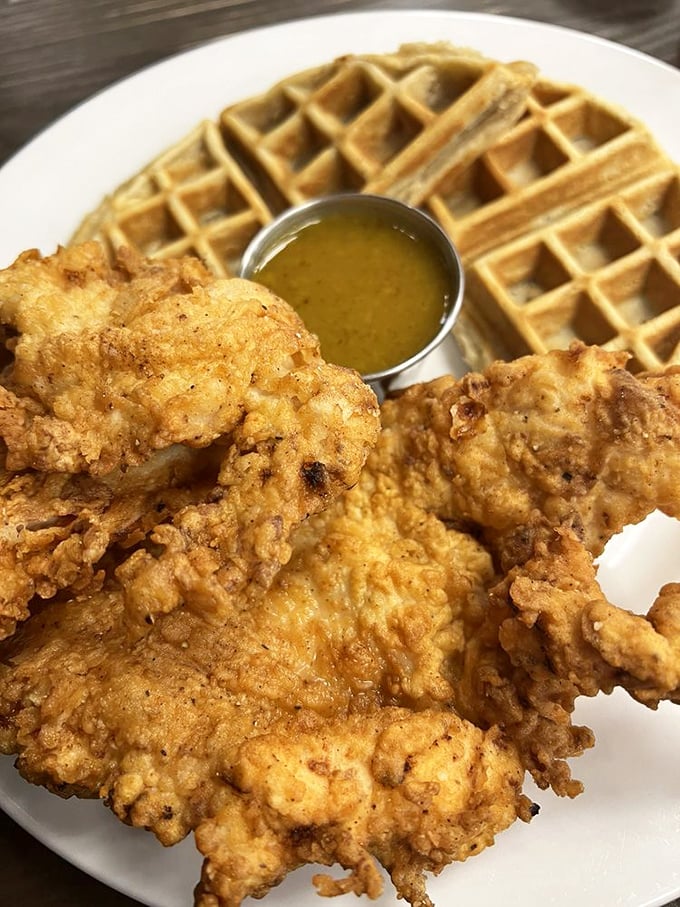 Not all heroes wear capes&mdash;some wear crispy batter atop golden waffles. The honey mustard sauce is the sidekick your taste buds never knew they needed.
