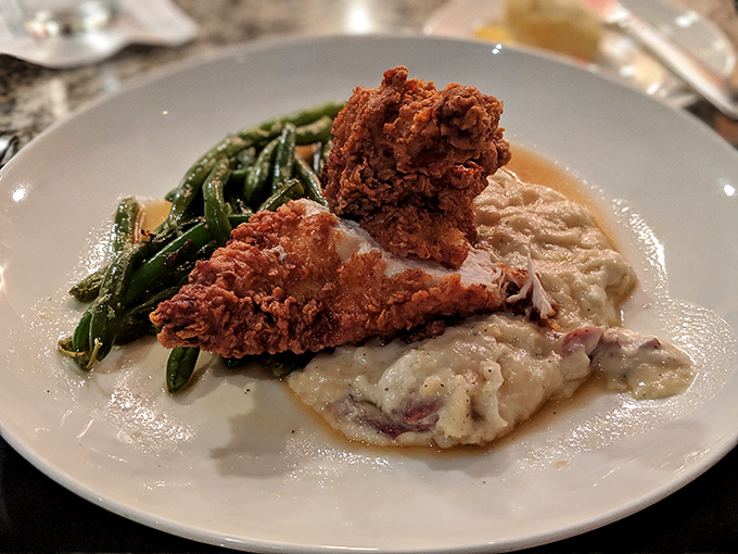 Behold! The famed fried chicken in its natural habitat, nestled beside those life-changing mashed potatoes and garden-fresh green beans.