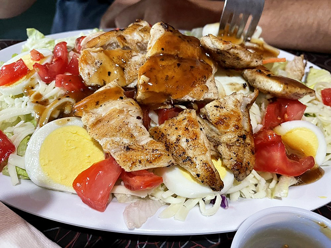 This isn't just a salad&mdash;it's a protest against sad desk lunches everywhere. Grilled chicken, fresh veggies, and hard-boiled eggs create a protein powerhouse.