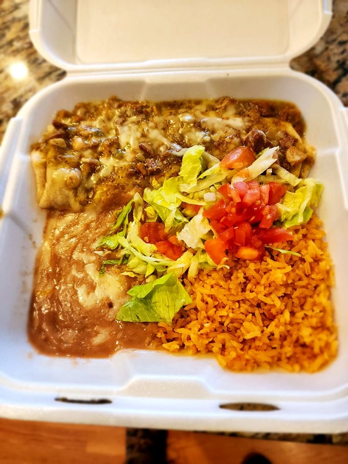 This isn't just a burrito—it's a masterclass in slow-cooked pork swimming in green chili sauce that makes you want to write poetry.