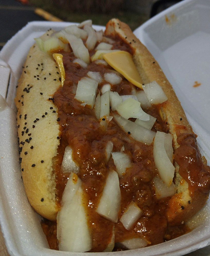 The chili dog at Woofie's doesn't just satisfy hunger&mdash;it answers questions you didn't know you had. That poppy seed bun cradles its contents like a mother holding her firstborn.