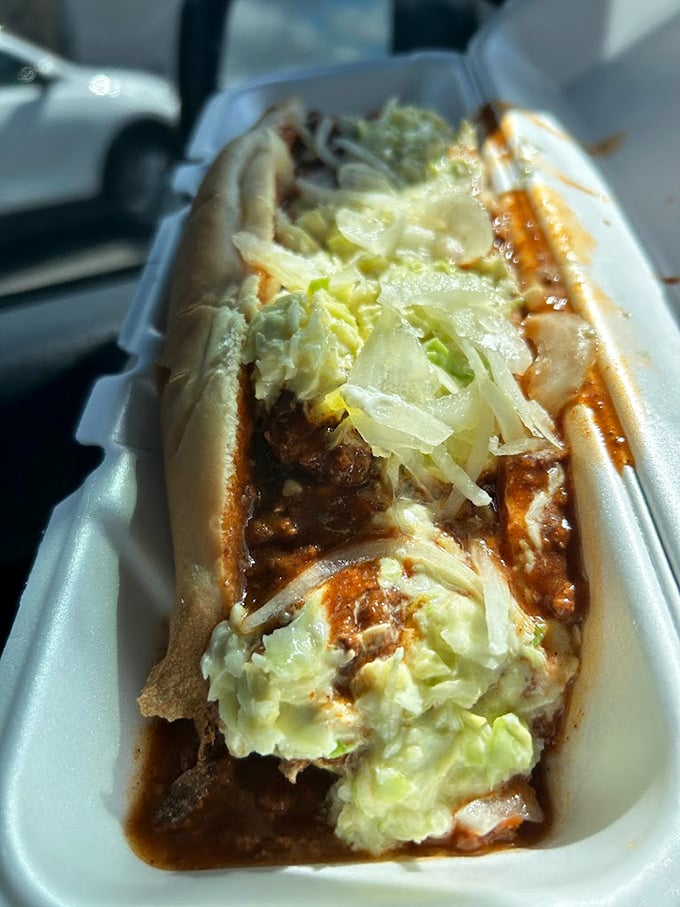 This isn't just a chili dog; it's an Arkansas institution wrapped in paper. The perfect ratio of meaty chili, crisp onions, and soft bun creates edible harmony.