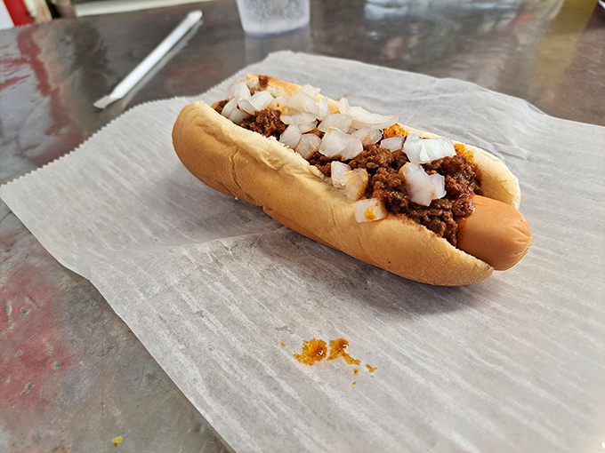 This isn't just a chili dog; it's a Roanoke handshake&mdash;meat, bun, and that signature chili topped with diced onions that crunch with each bite.