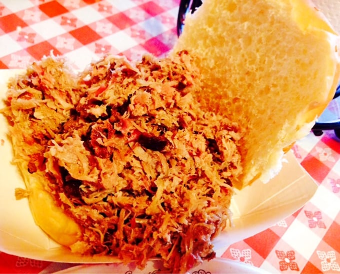 This pulled pork sandwich isn't just a meal, it's a masterclass in barbecue architecture &ndash; a perfect ratio of meat to bun that'll haunt your dreams.