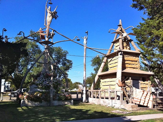 Concrete sculptures reach skyward at the Garden of Eden, where Civil War veteran Dinsmoor created his masterpiece one limestone pour at a time.