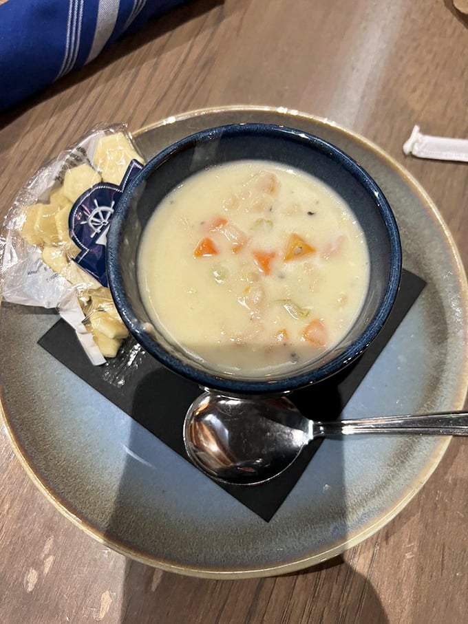 Creamy comfort in a blue ceramic bowl. This isn't just clam chowder&mdash;it's a warm hug from the Atlantic Ocean that somehow found its way to Indiana.