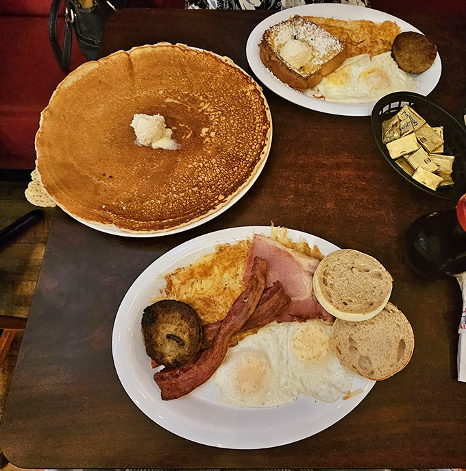 That pancake isn't just hanging off the plate; it's making a bold statement about American abundance that would make Norman Rockwell reach for a fork.