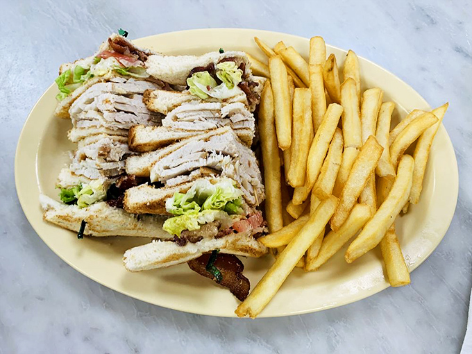 This club sandwich doesn't just stack ingredients&mdash;it builds a skyscraper of flavor that requires structural engineering and an impressive appetite.