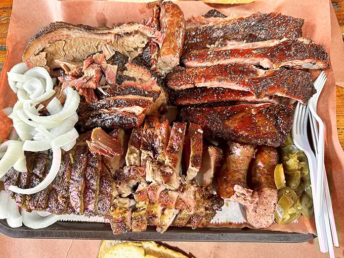 A meat symphony arranged on butcher paper—the kind of spread that makes vegetarians question their life choices.