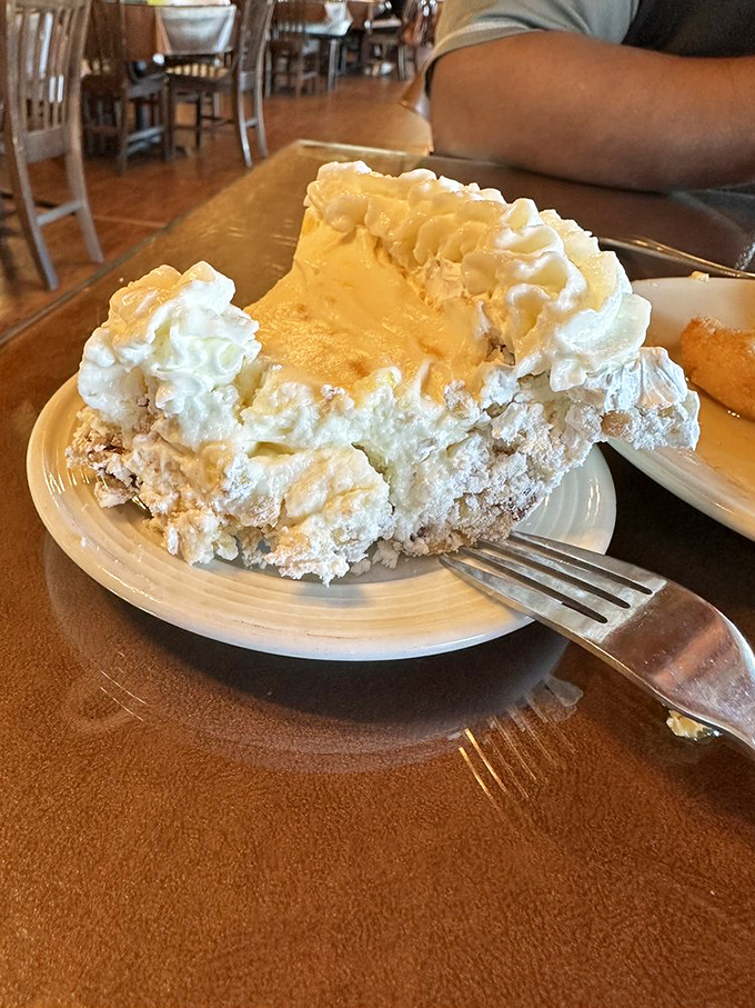 The legendary Company's Comin' Pie - Arkansas's official state pie - combining meringue, pecans, pineapple and whipped cream into a cloud-like confection.