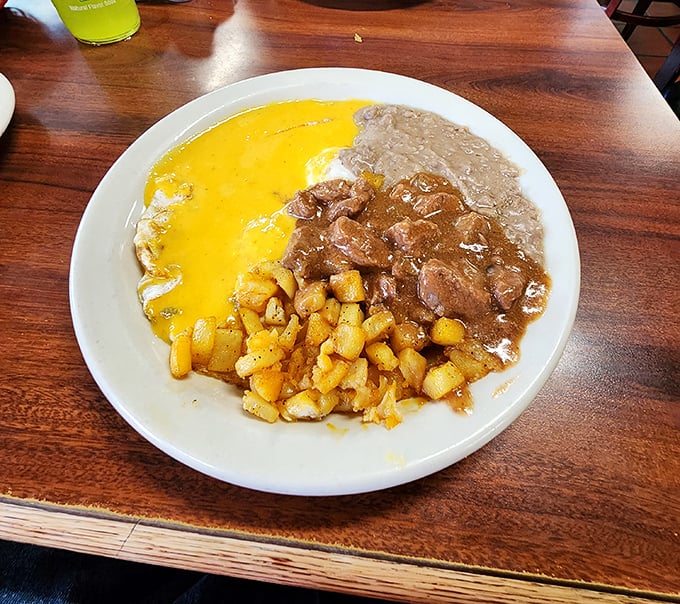 Eggs, potatoes, and refried beans create the holy trinity of Tex-Mex breakfast. This plate doesn't just feed you&mdash;it hugs your soul and high-fives your taste buds.