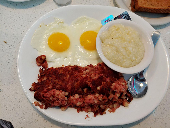 Corned beef hash with sunny-side-up eggs &ndash; where the yolks break with all the drama of a Florida sunset, creating a sauce that demands toast for dipping.