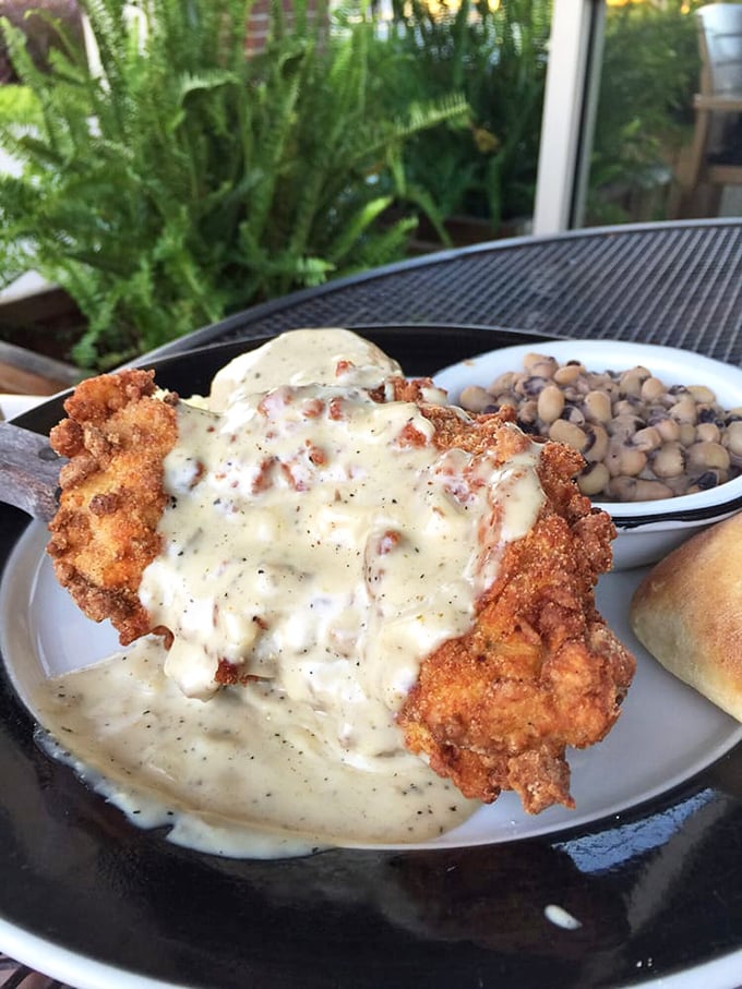 Golden-crusted country fried chicken swimming in sausage gravy&mdash;proof that sometimes the most beautiful art comes on a plate, not a canvas.