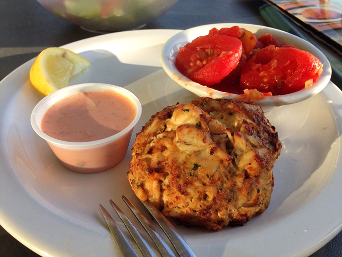 The star of the show in its natural habitat&mdash;a golden-brown crab cake that's more crab than cake, served with a side of Florida sunshine.
