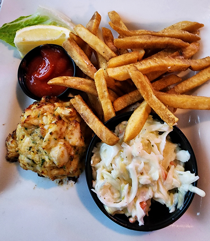 Golden-brown perfection meets minimal filler in this crab cake that's more crustacean than cake. The coleslaw's not bad either, but we know why you're here.