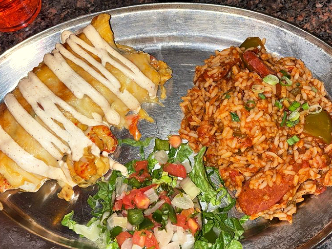 Louisiana meets Missouri on a metal plate: jambalaya rich as a jazz solo alongside what might be the best-dressed fries in the Midwest.