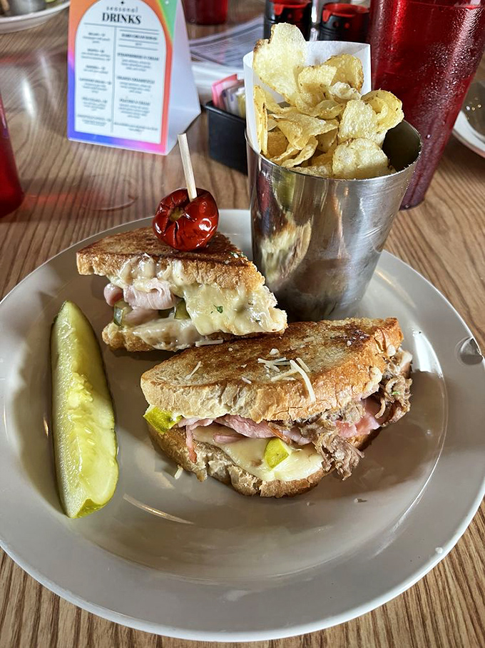 Layers of melted cheese embrace savory meats between perfectly toasted bread&mdash;this isn't your childhood sandwich, it's your childhood sandwich's glow-up.