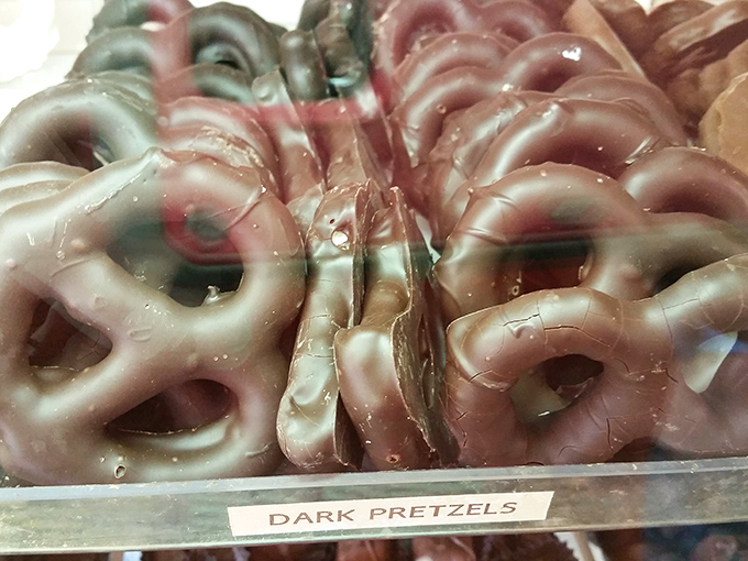 Dark chocolate pretzels glisten under the display lights, their sweet-salty marriage proving that opposites really do attract&mdash;especially in your mouth.