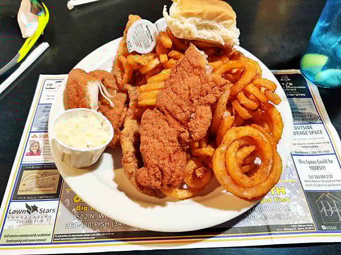 Golden-battered cod that shatters like glass alongside curly fries that could double as edible Slinkys. This is happiness on a plate.