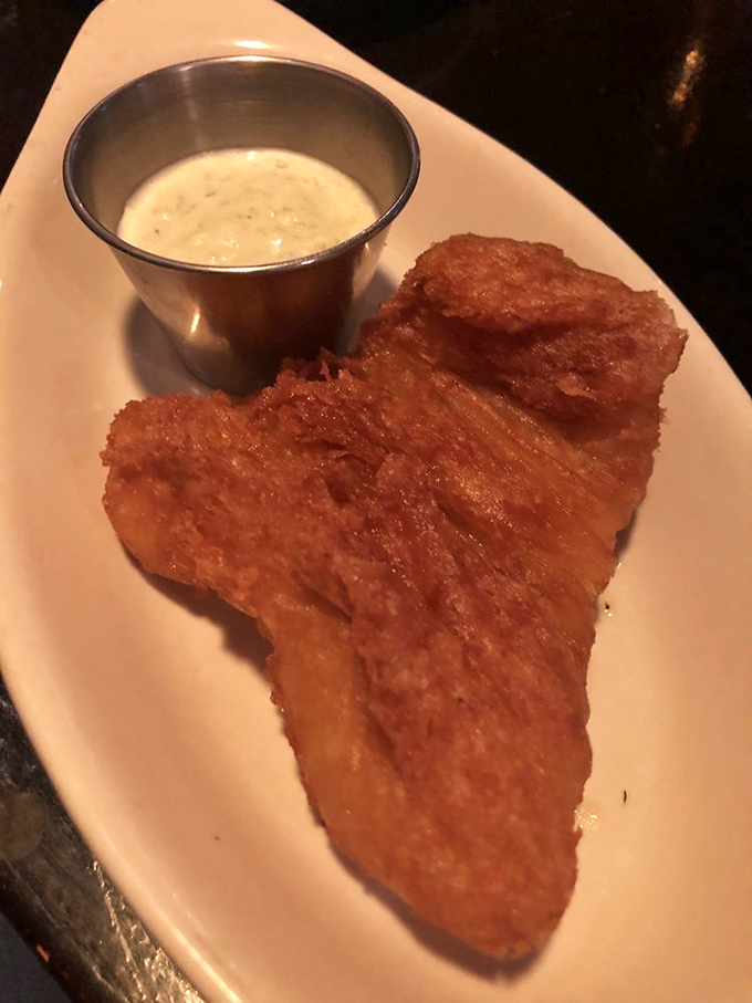 Golden-brown perfection that makes you wonder if the fish volunteered for the fryer, knowing it would achieve immortality on your taste buds.