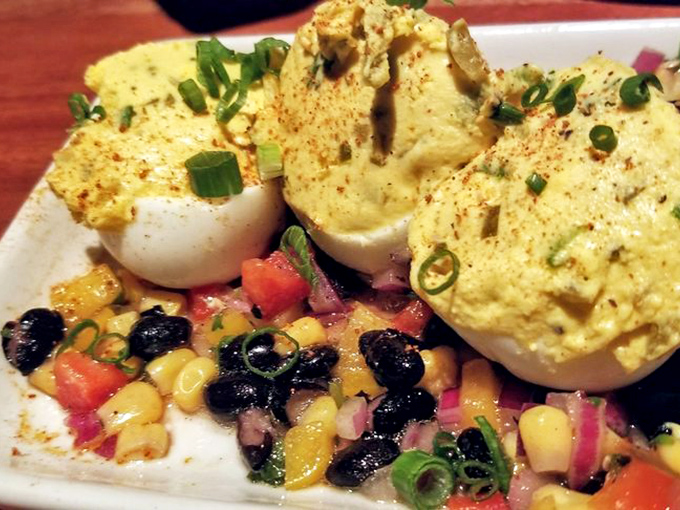 Not all deviled eggs are created equal. These golden beauties, perched atop a colorful corn and black bean salsa, are what food dreams are made of.