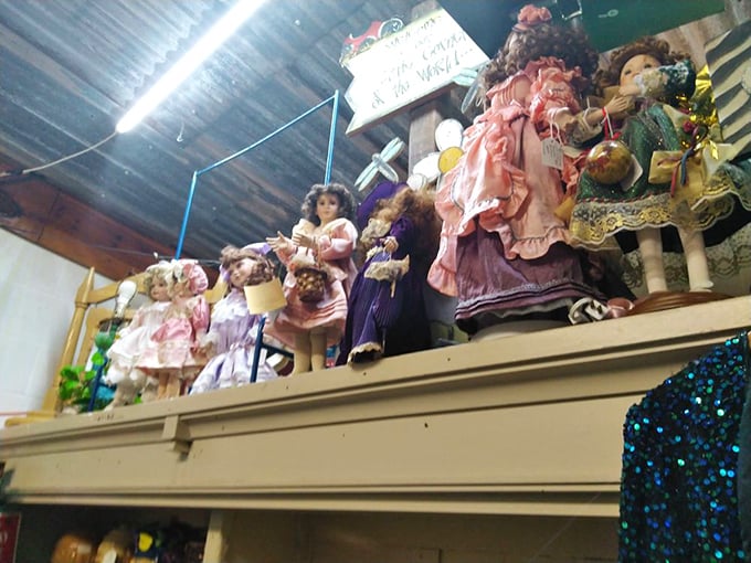 The silent sentinels of childhood past. These porcelain-faced time travelers have witnessed decades of history from their perch above the browsing crowds.