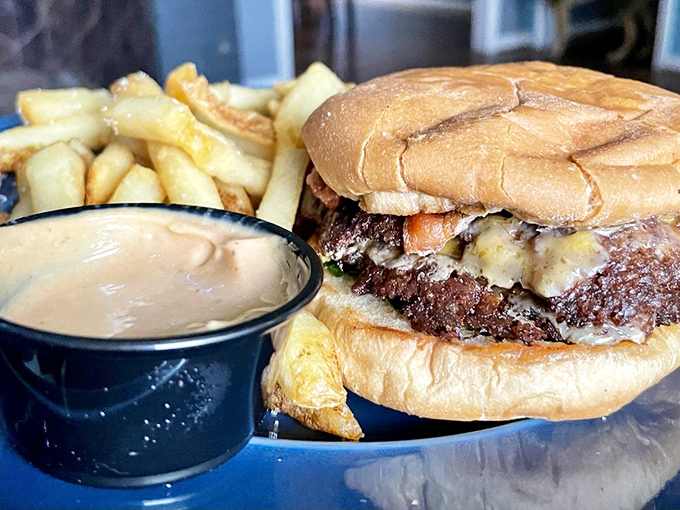 This isn't just a burger&mdash;it's edible architecture where each layer contributes to the symphony of flavors. The sauce cup is standing by for backup.